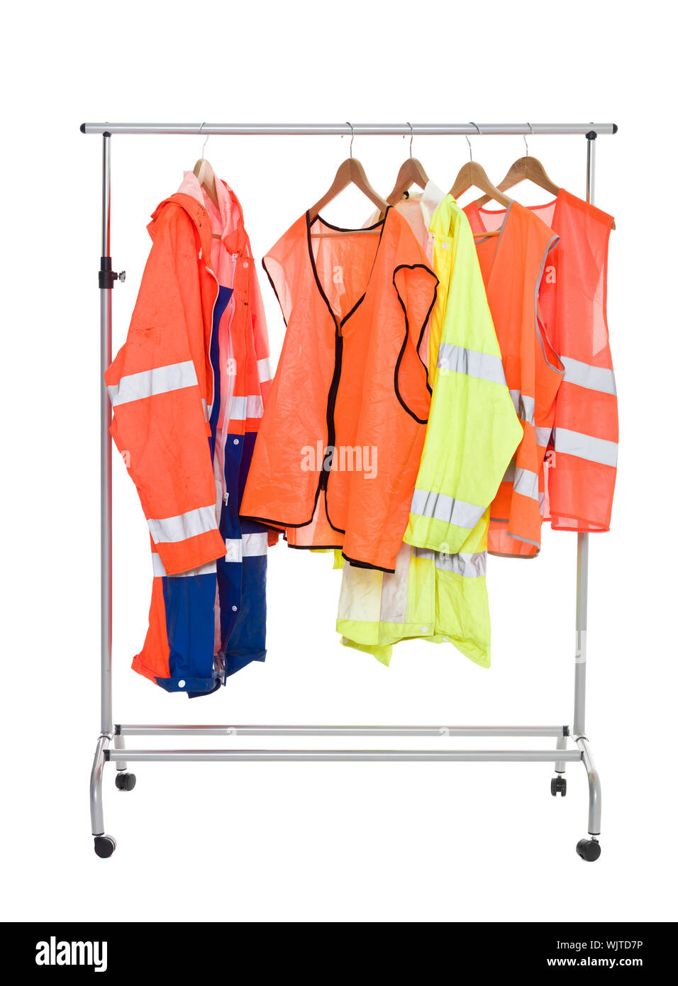 Colored Workwear hanging on a Clothes Rack isolated Stock Photo - Alamy
