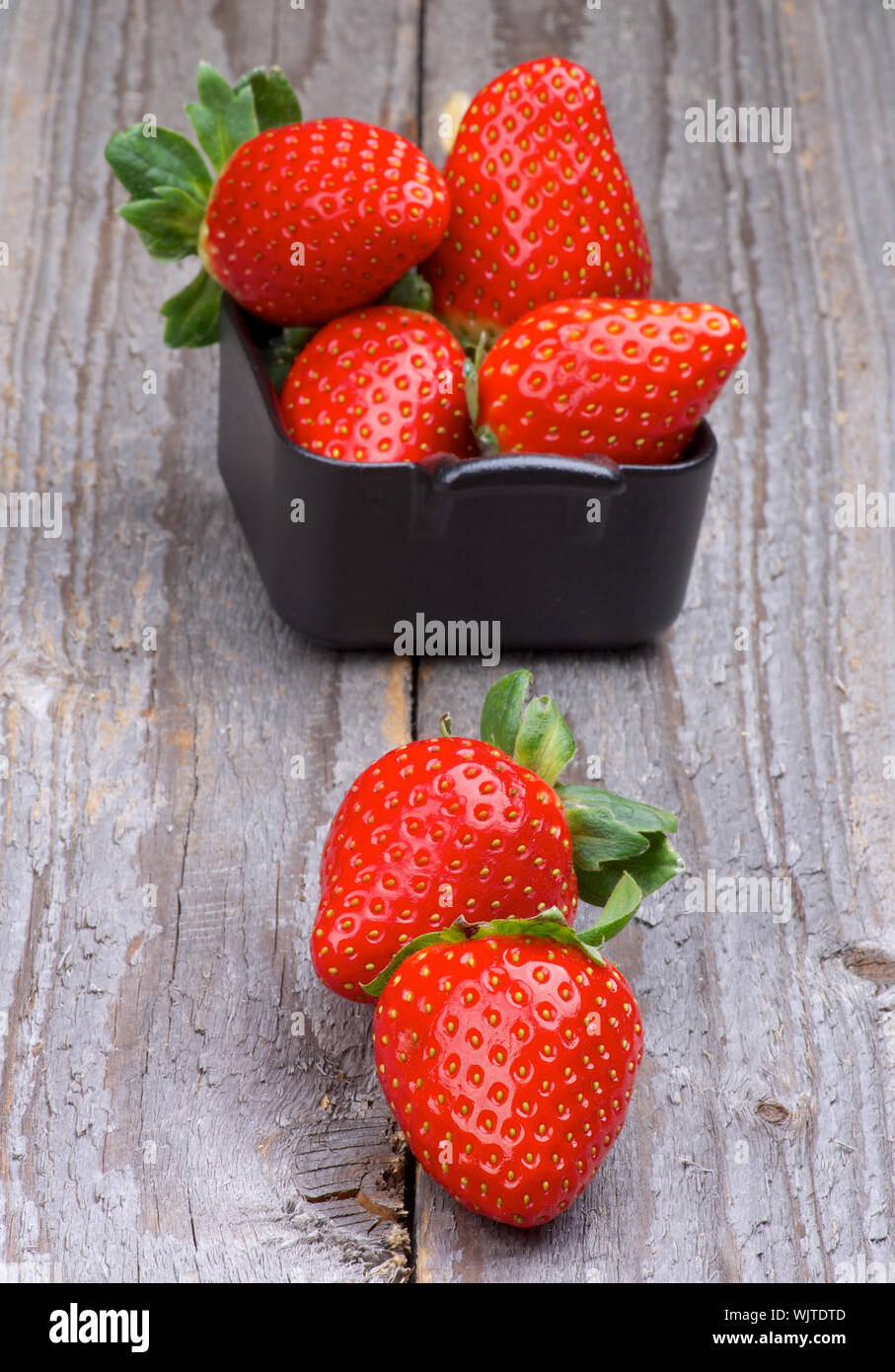 Arrangement of Perfect Raw Strawberries in Square Shape Black Bowl ...