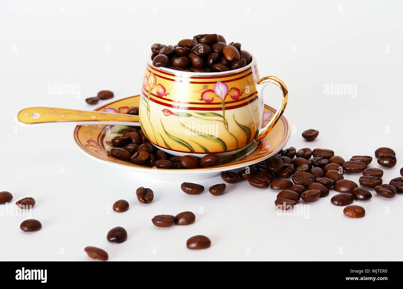 coffee cup is taken pictures on subject table under artificial ...
