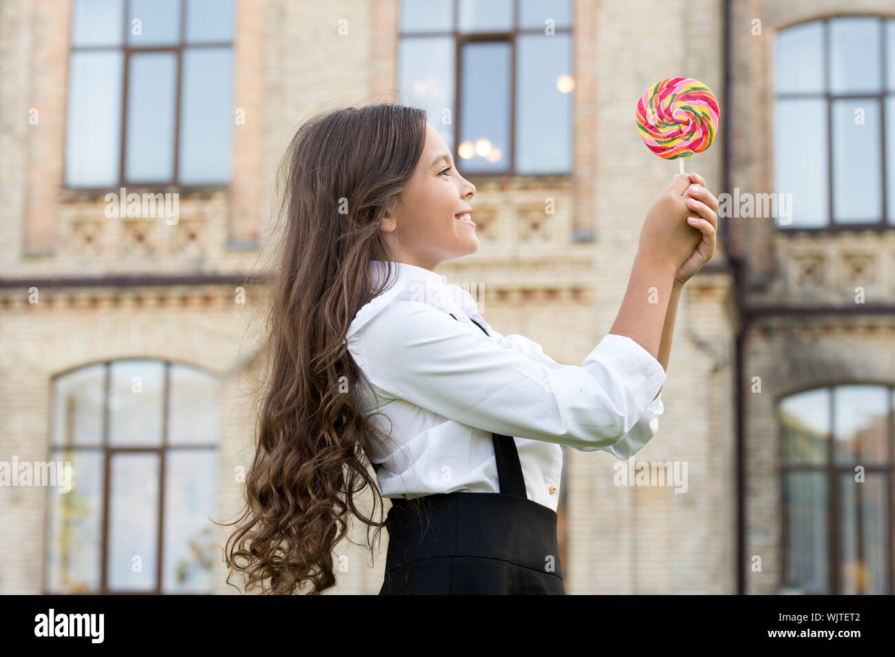 Happy kid with sweet candy. Happy childhood. Kid child holding lollipop ...