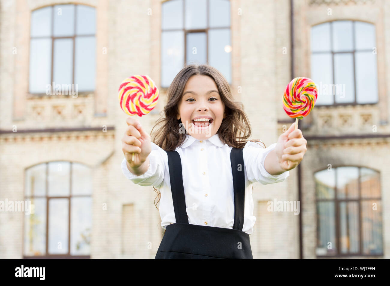 Both mine. Cheat meal day. Happy kid with sweet candy. Kid child ...