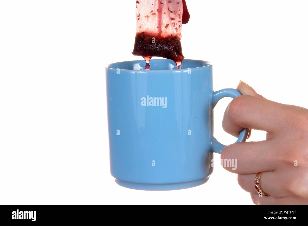 hand with mug isolated on white background Stock Photo - Alamy