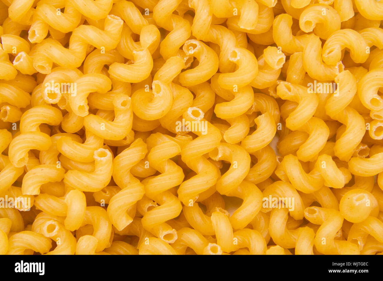 raw macaroni,rest upon plate Stock Photo - Alamy
