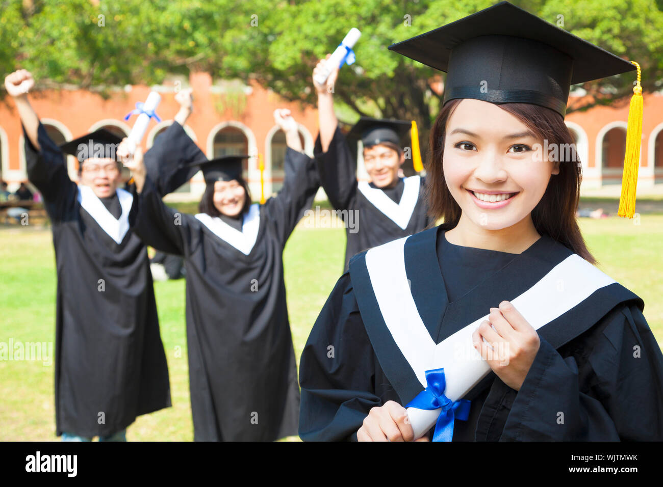 college graduate with happy classmates Stock Photo - Alamy