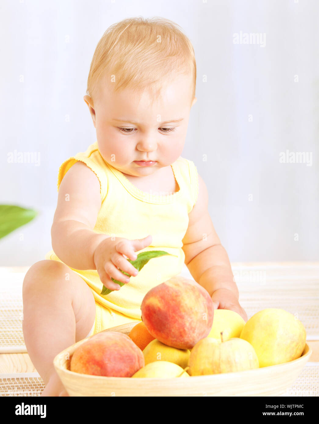 Cute baby with fruits Stock Photo - Alamy