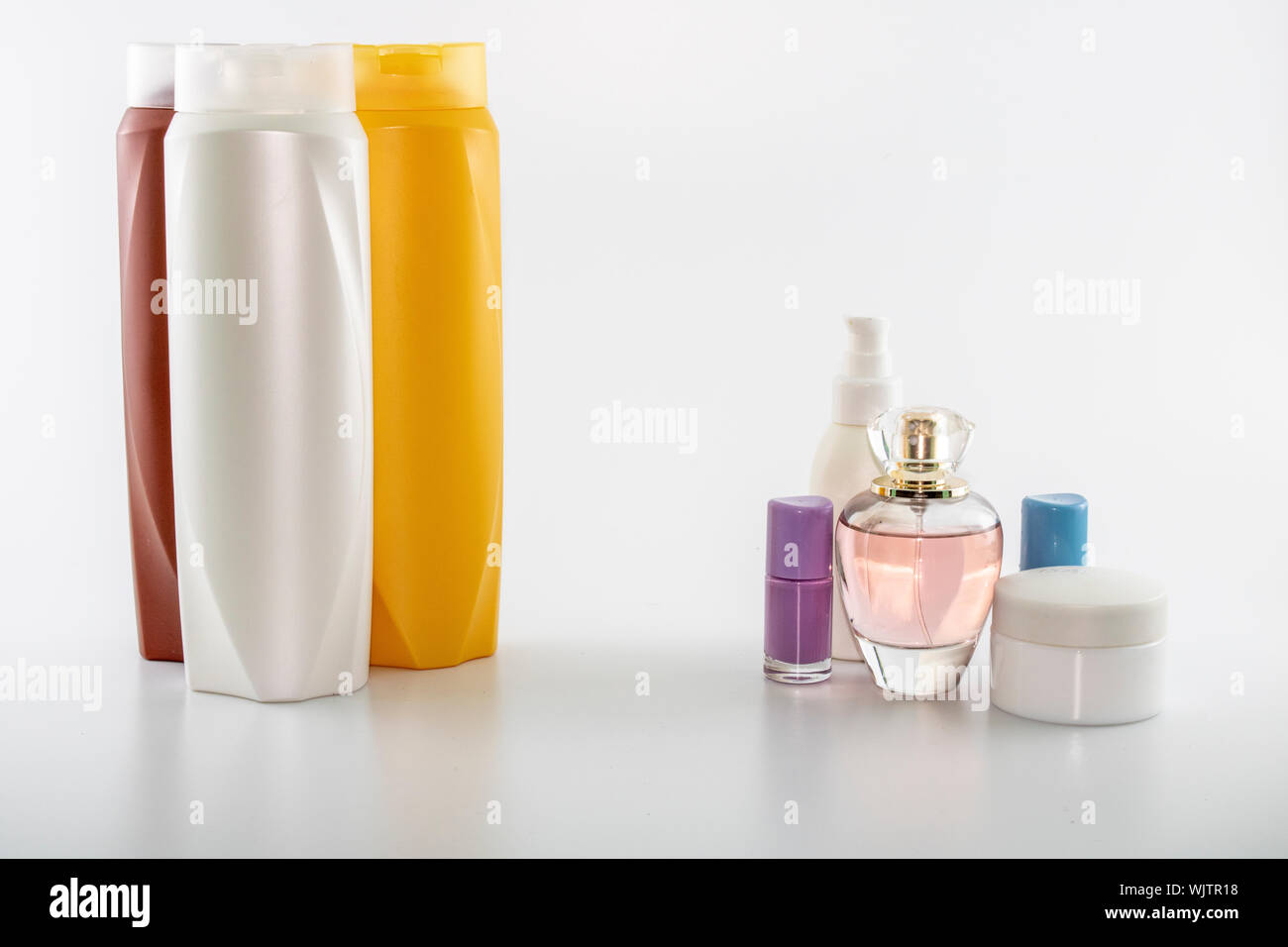 Shampoo, sun cream, nail polish, parfum. Isolated on white background ...
