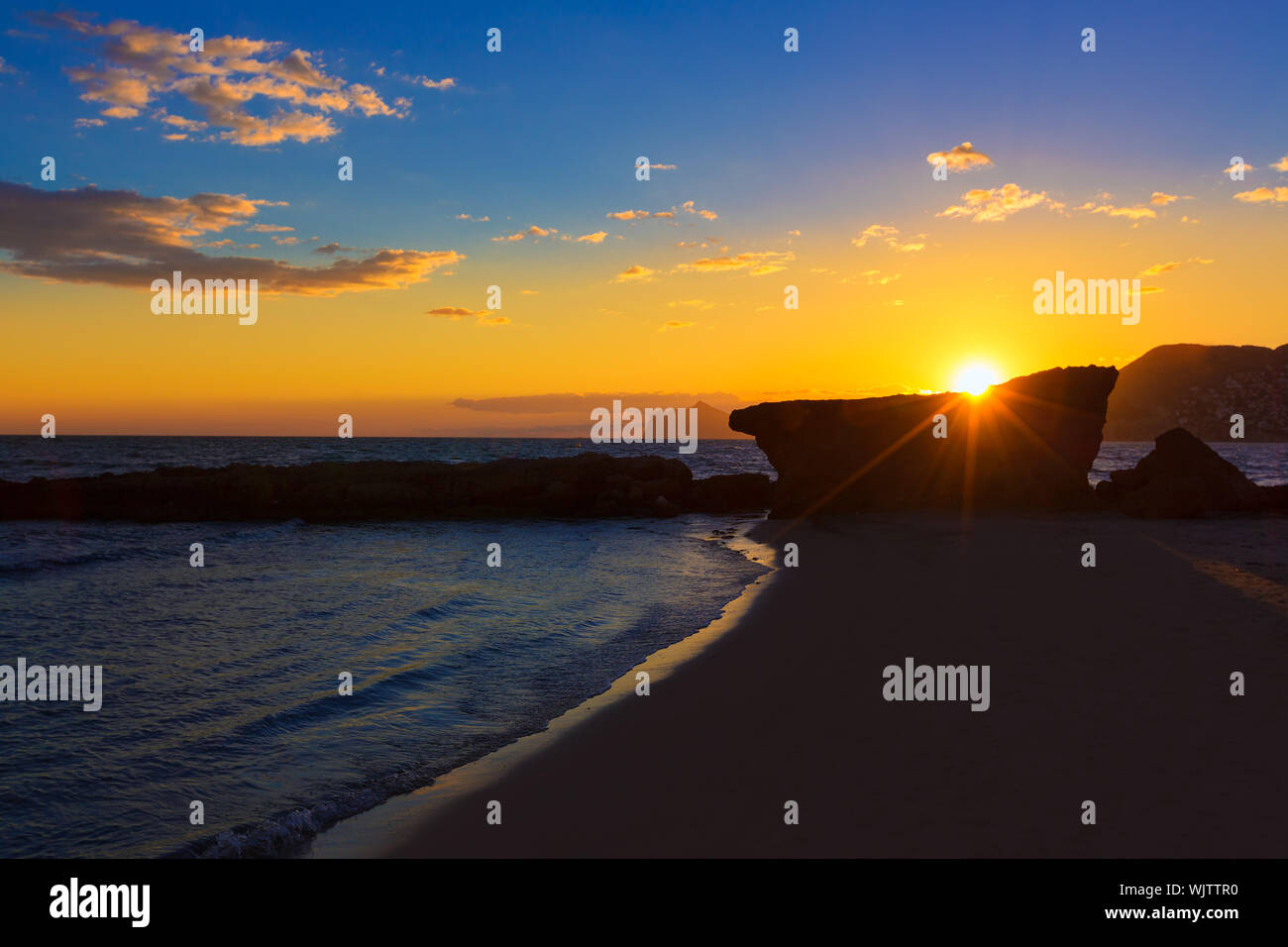Calpe Alicante sunset at beach Cantal Roig in Mediterranean Spain Stock ...