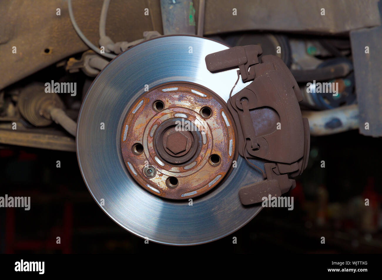Car wheel brake rusty disc with pads rotor disc and caliper assembly ...