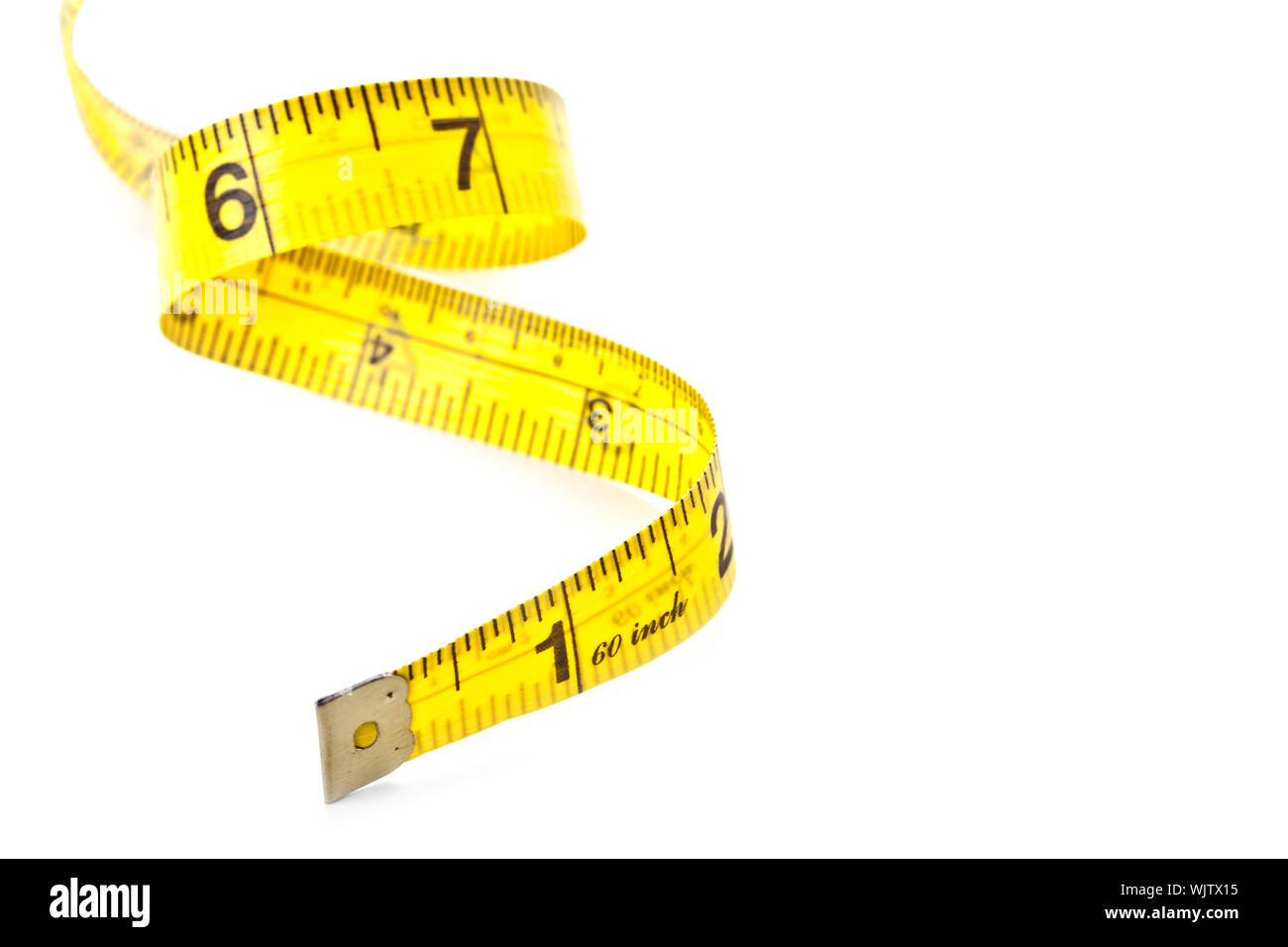 yellow measuring tape isolated on white background Stock Photo - Alamy