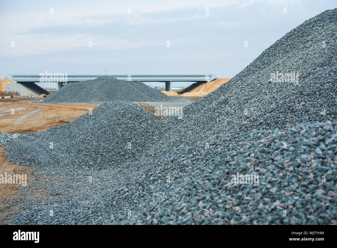 view road works trough pile of gravel Stock Photo - Alamy