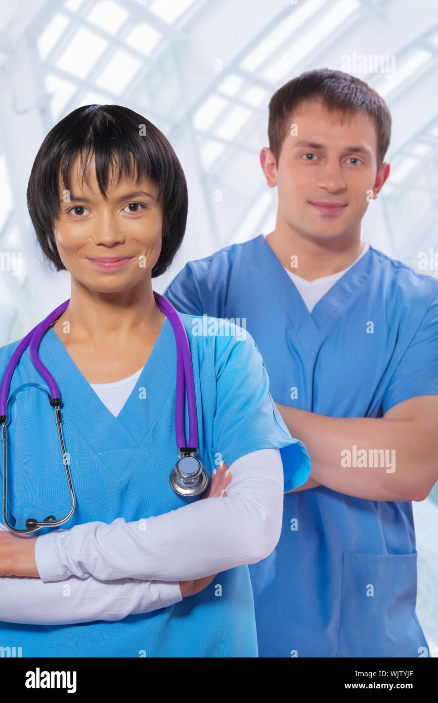 Portrait of medical workers in corridor of modern hospital Stock Photo ...