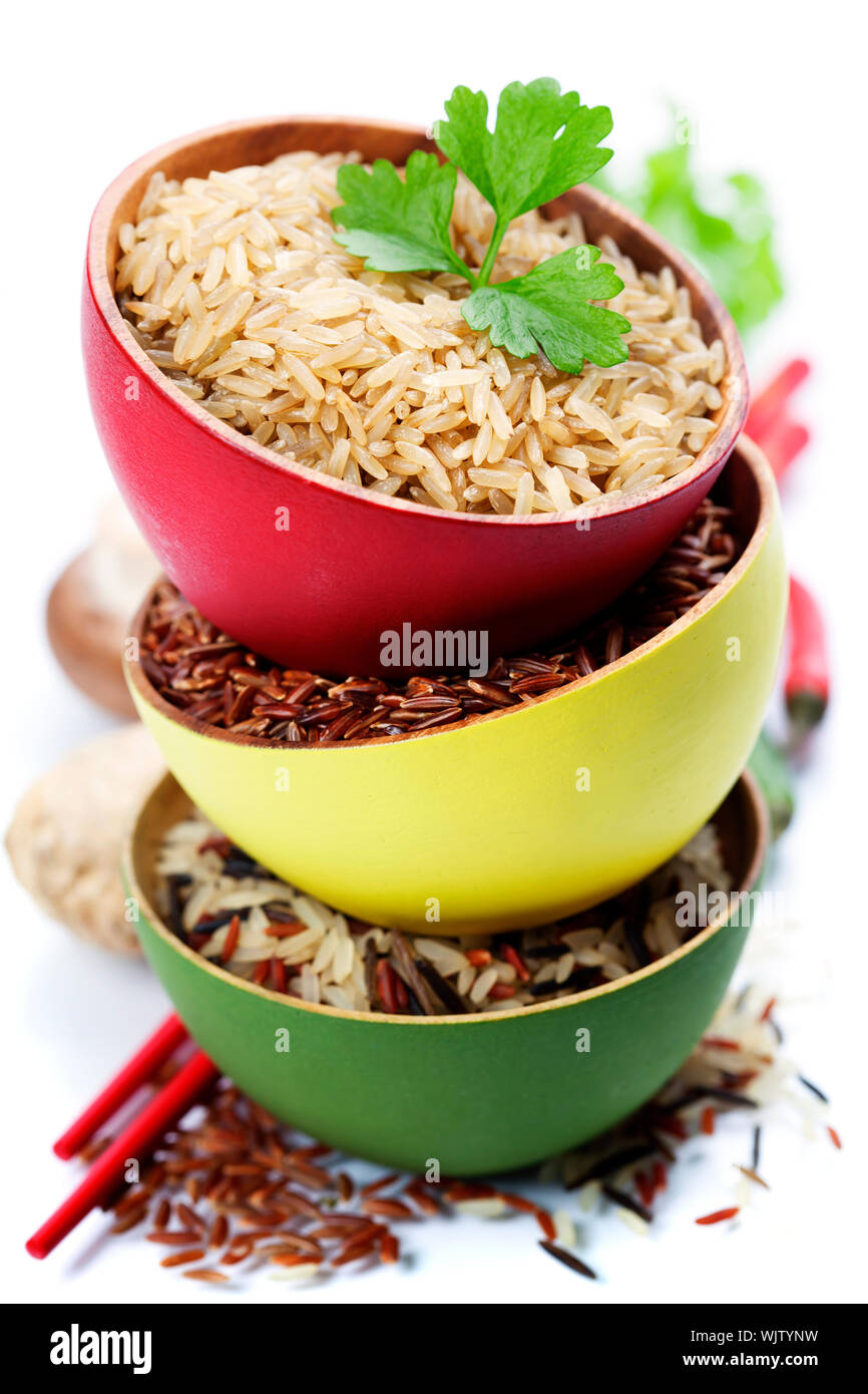 Three bowls with different types of rice on white background Stock ...