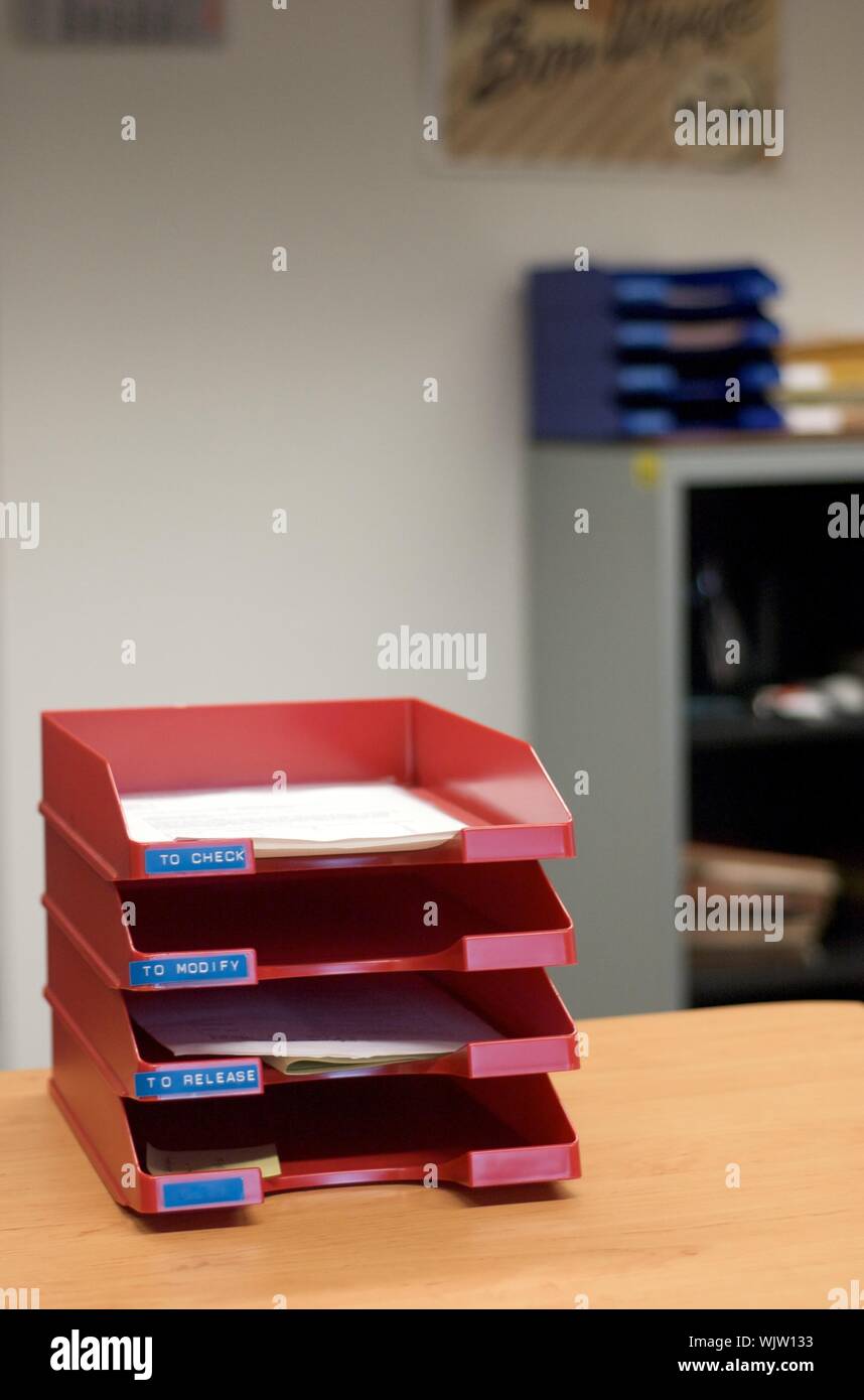 Documents arranged in trays in an office room Stock Photo - Alamy
