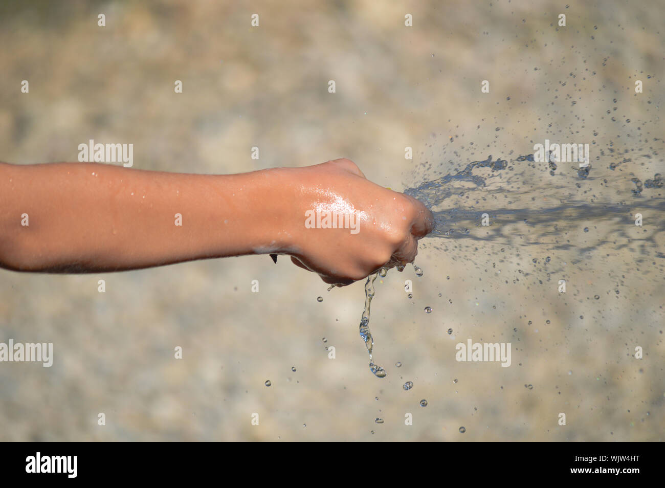 Wet hand hi-res stock photography and images - Alamy