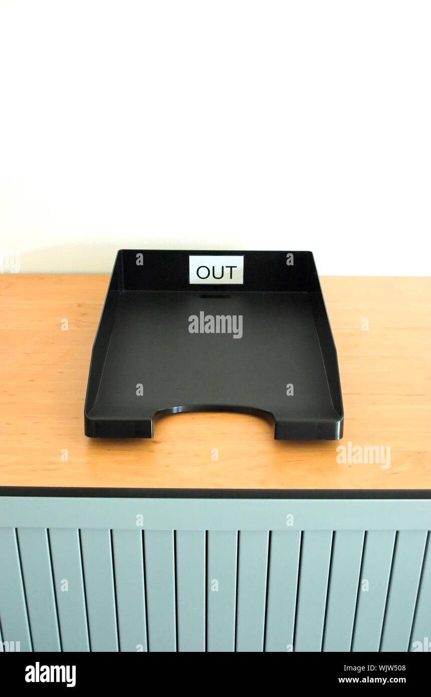 Internal mail trays on a cupboard in an office Stock Photo - Alamy