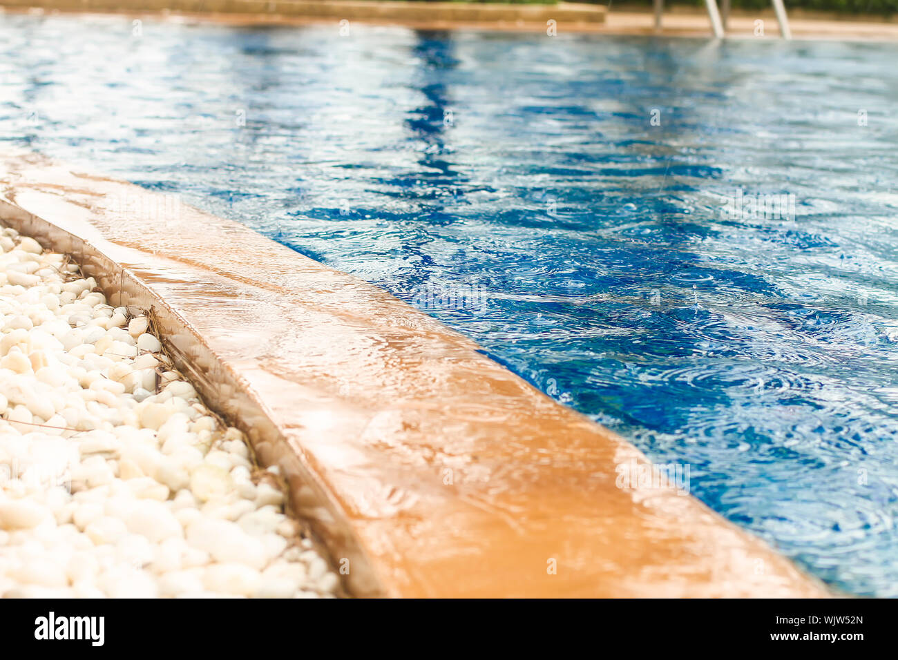 Beautiful tropical swimming pool in the rain Stock Photo - Alamy
