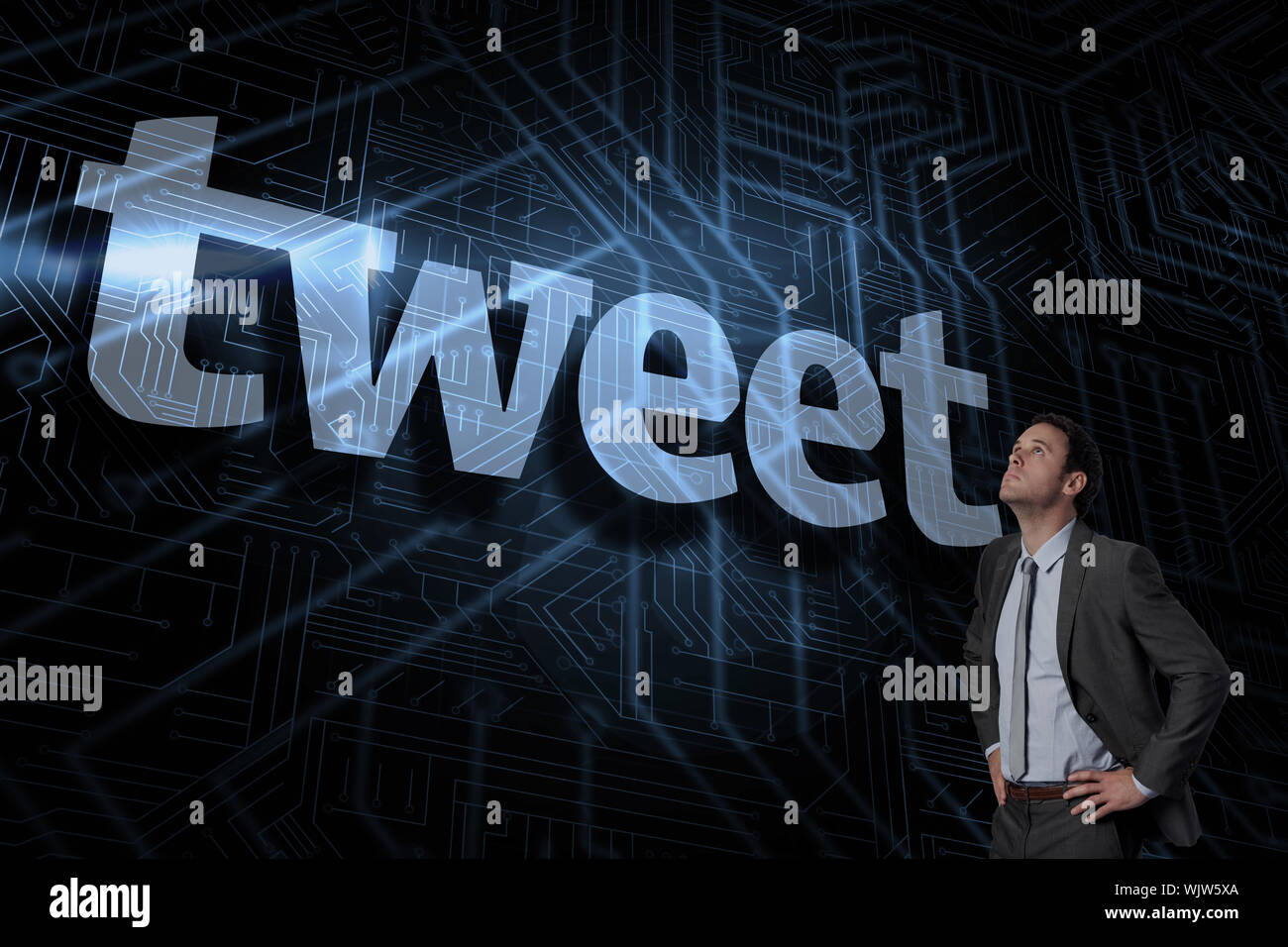 The word tweet and serious businessman with hands on hips against ...