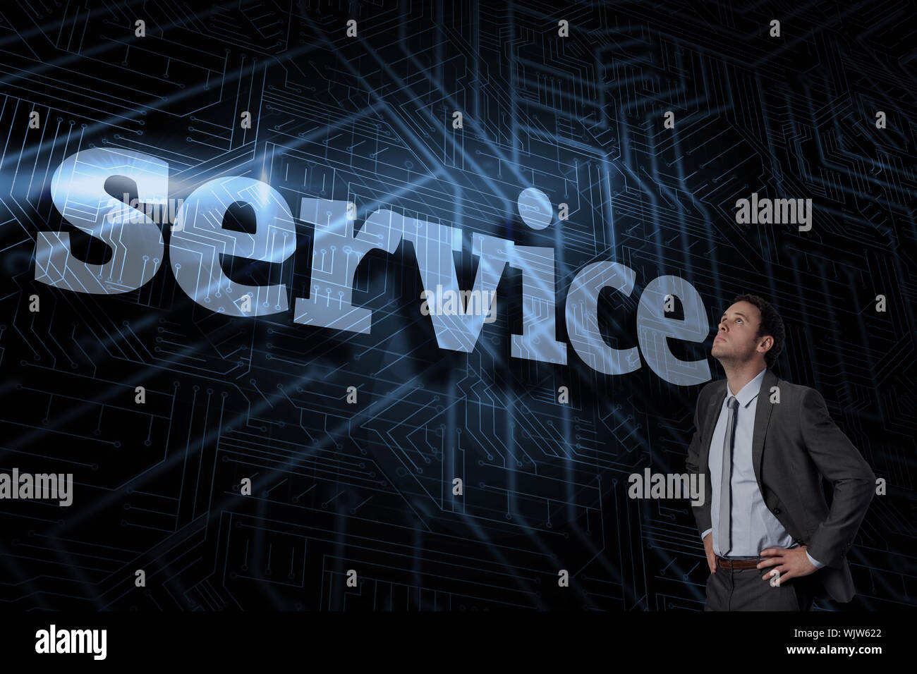 The word service and serious businessman with hands on hips against ...