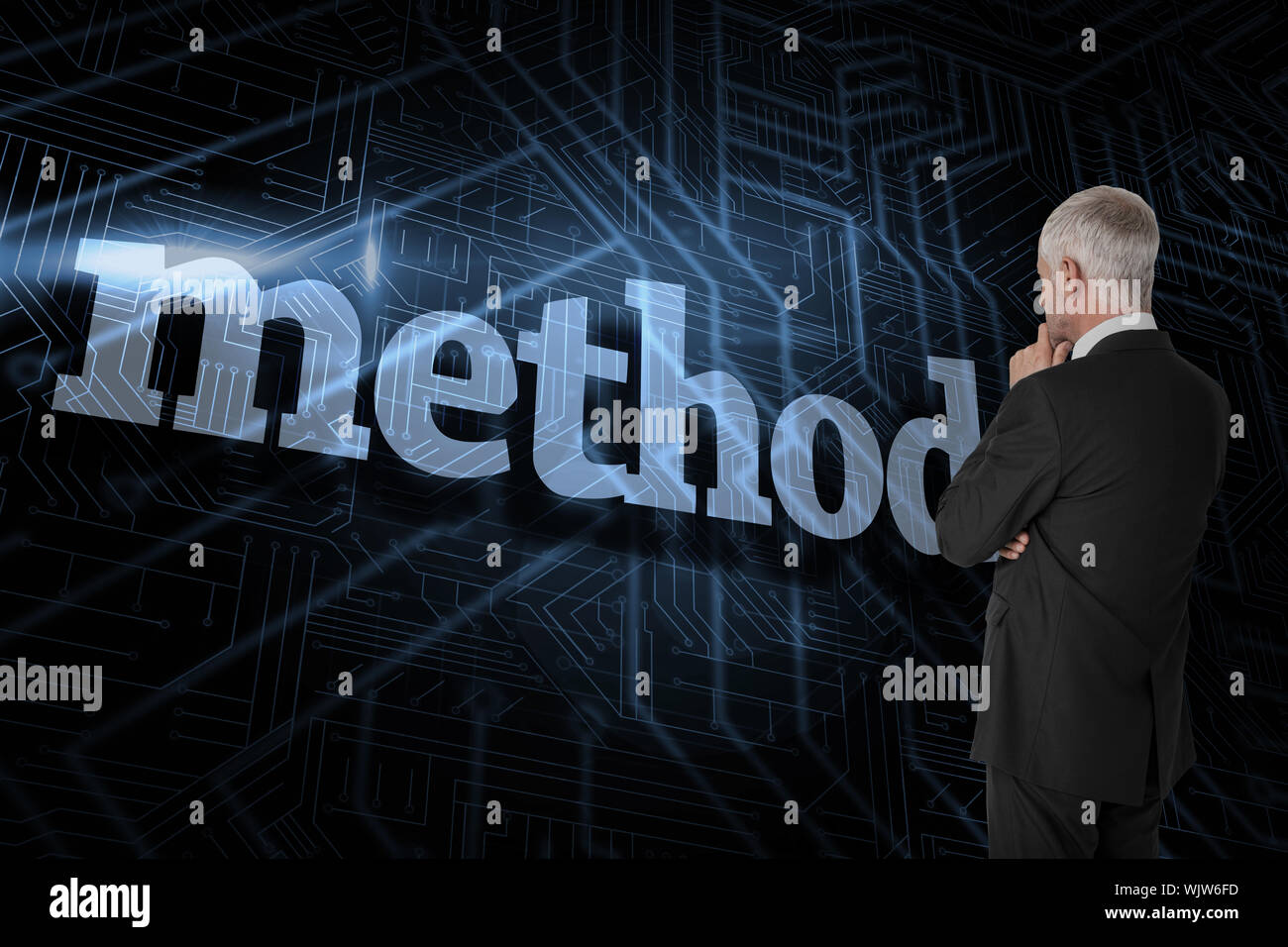 The word method and thoughtful businessman standing back to camera ...