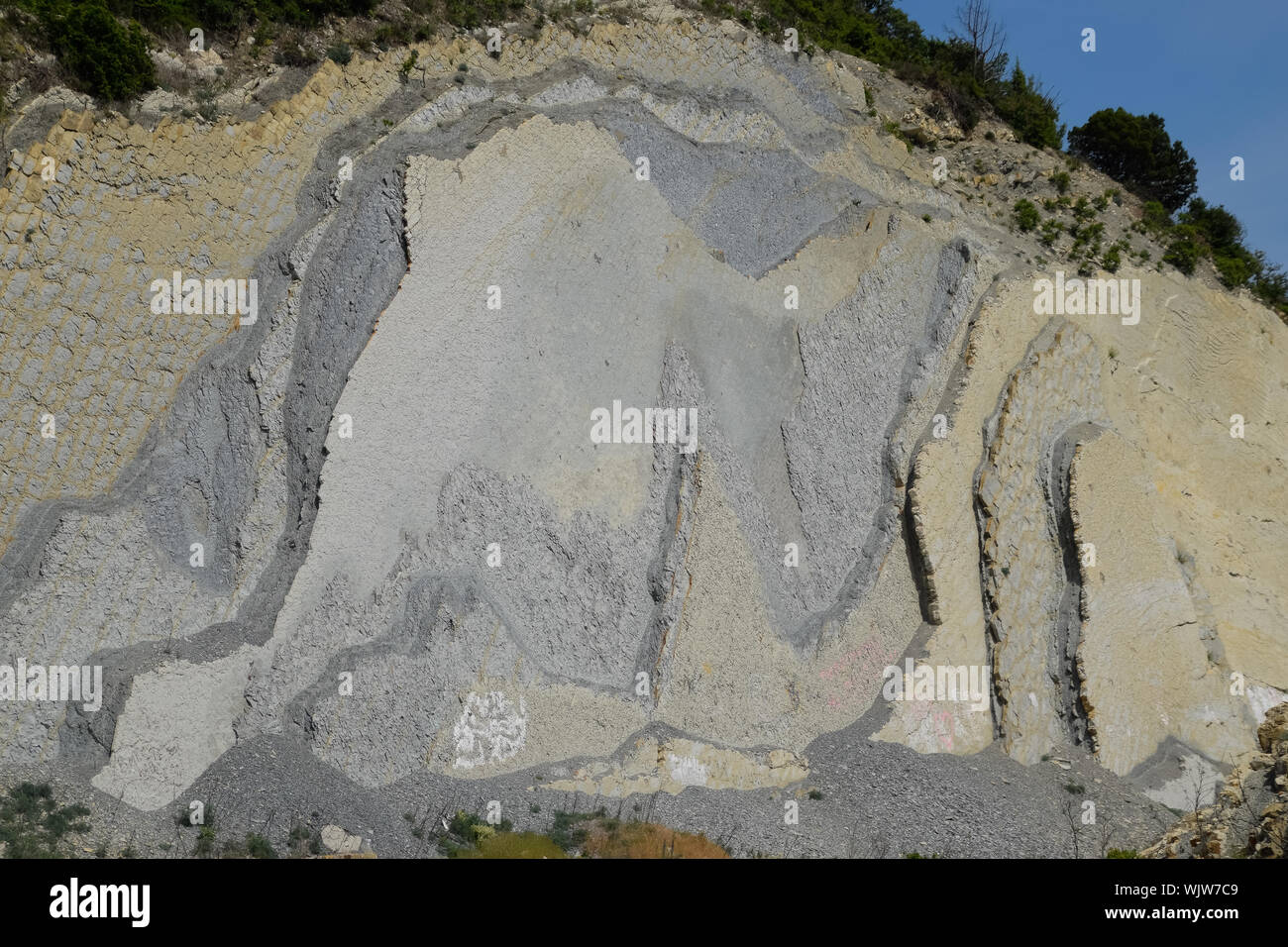 slope of the mountain with layers of sedimentary rocks. Vertically ...