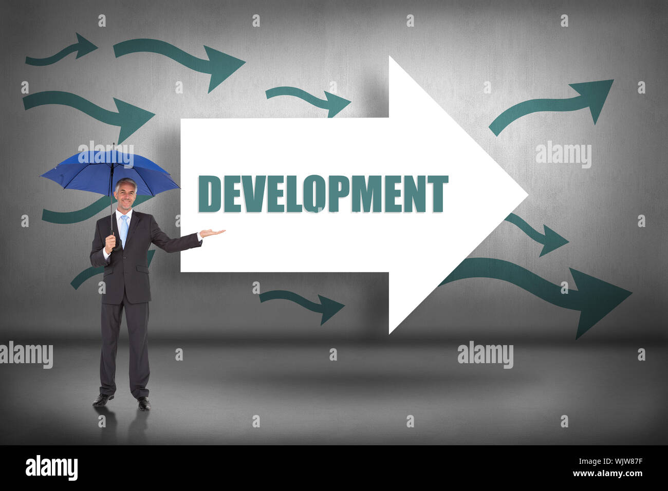 The word development and peaceful businessman holding blue umbrella ...