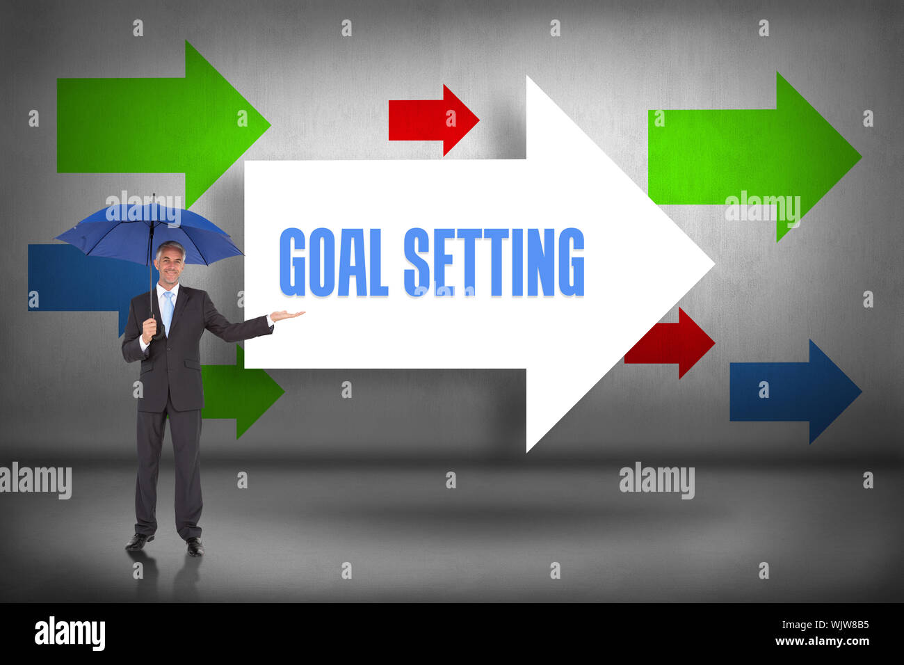 The word goal setting and peaceful businessman holding blue umbrella ...