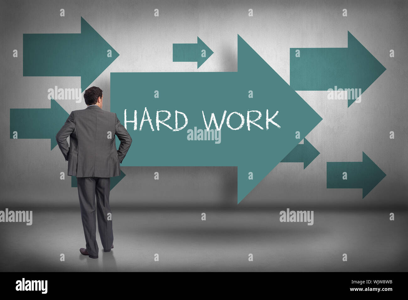 The word hard work and businessman with hands on hips against blue ...