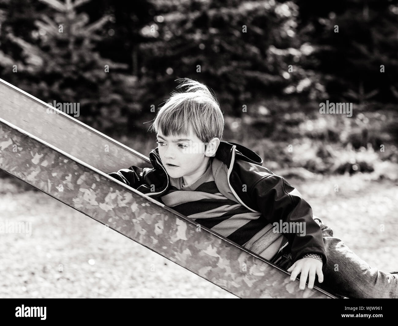 Boy on slide hi-res stock photography and images - Alamy
