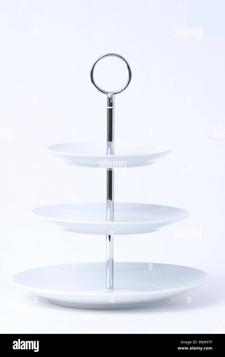 Stoneware three - level cake stand Stock Photo - Alamy