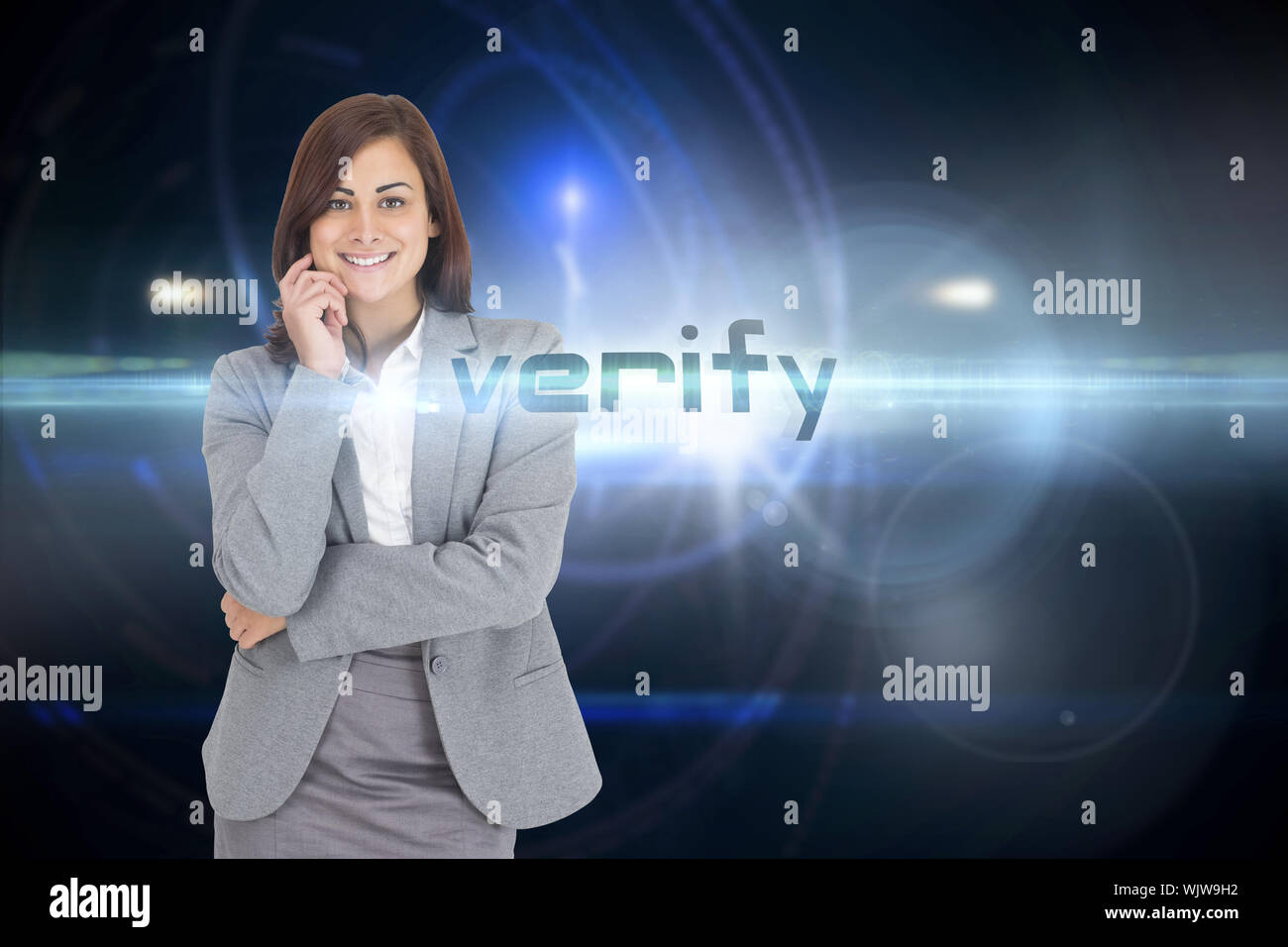 The word verify and smiling thoughtful businesswoman against futuristic ...