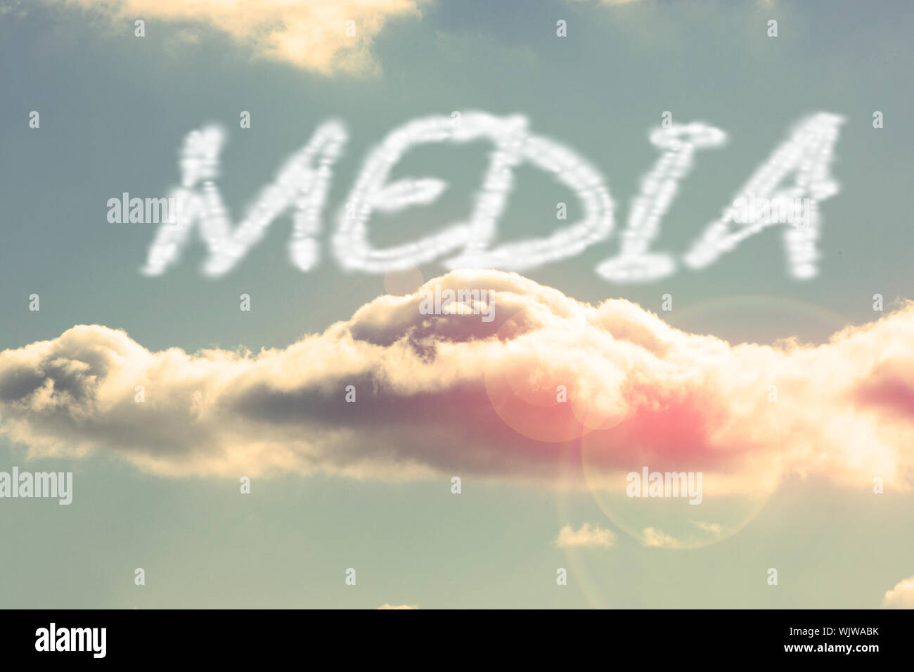 The word media against bright blue sky with cloud Stock Photo - Alamy