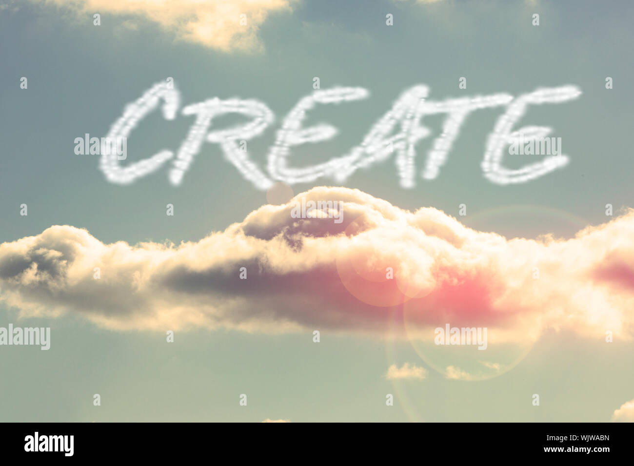 The word create against bright blue sky with cloud Stock Photo - Alamy