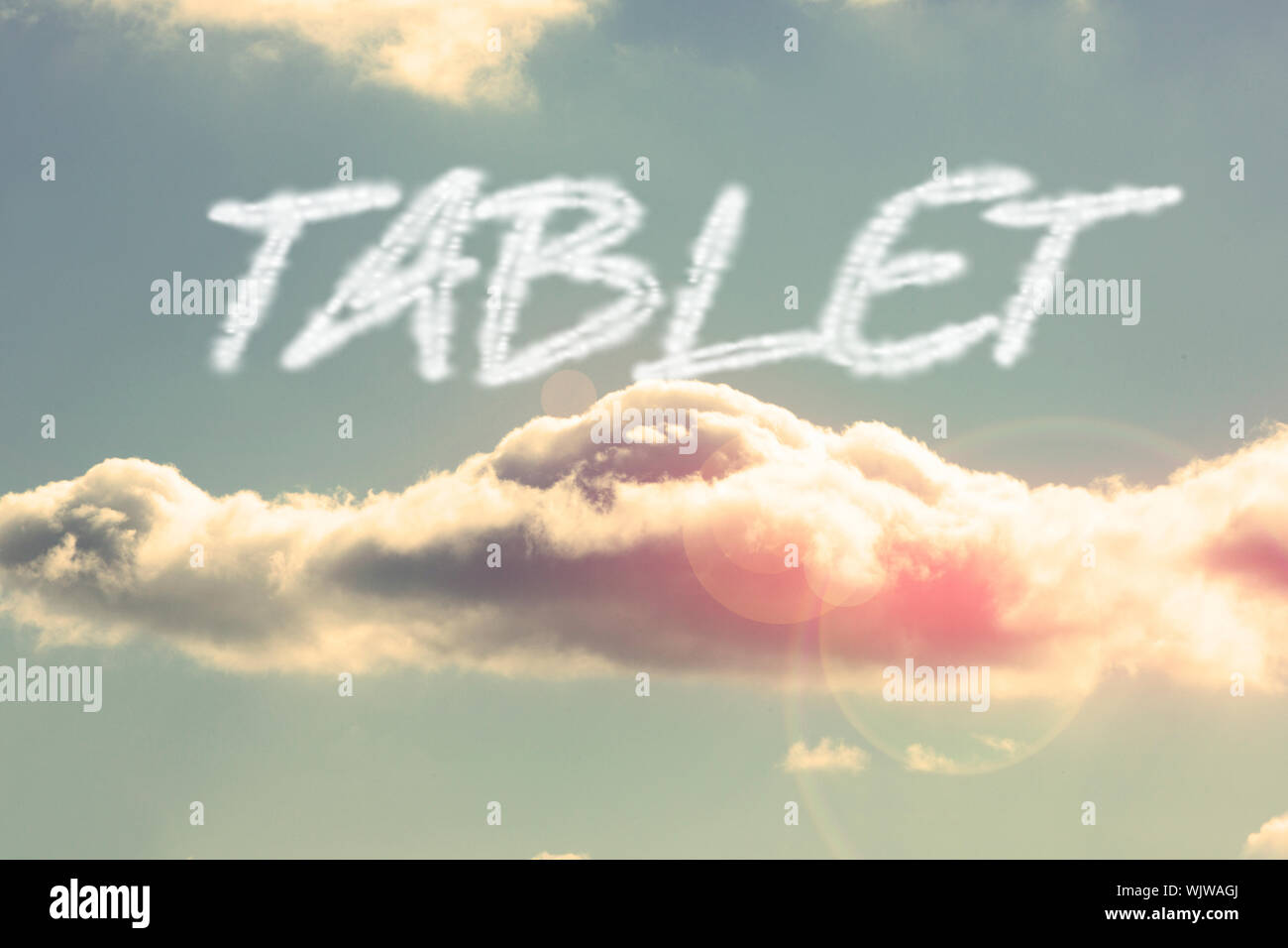 The word tablet against bright blue sky with cloud Stock Photo - Alamy