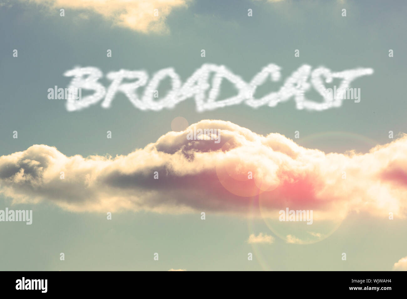 The word broadcast against bright blue sky with cloud Stock Photo - Alamy