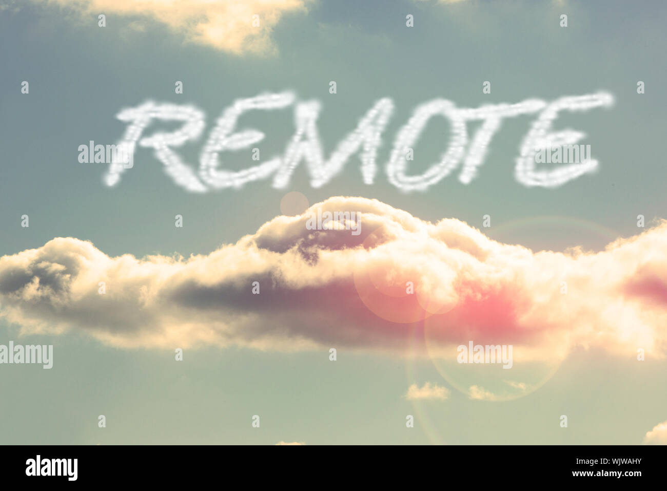 The word remote against bright blue sky with cloud Stock Photo - Alamy