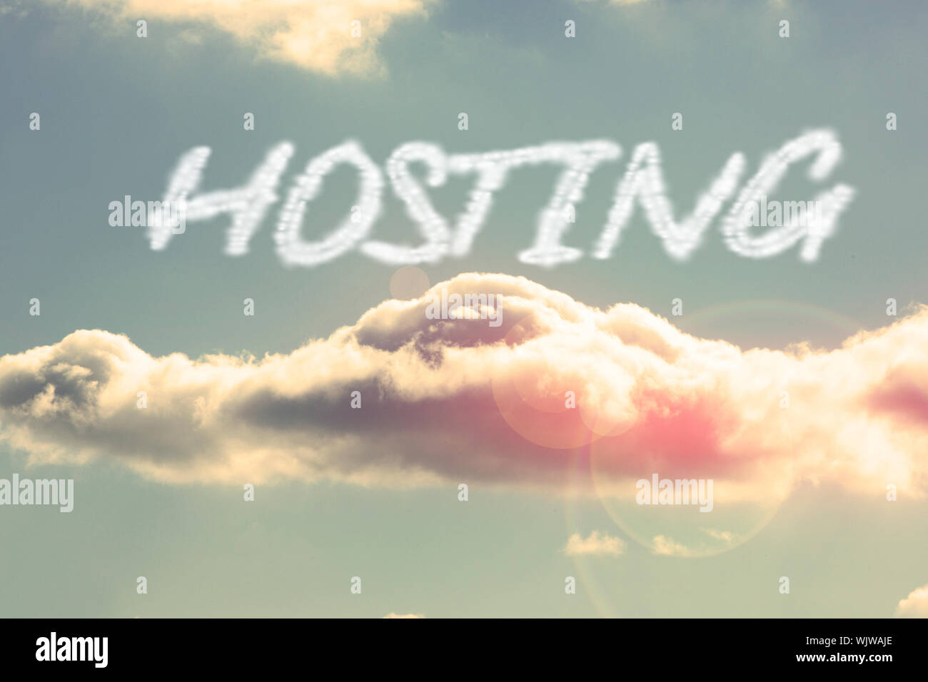 The word hosting against bright blue sky with cloud Stock Photo - Alamy
