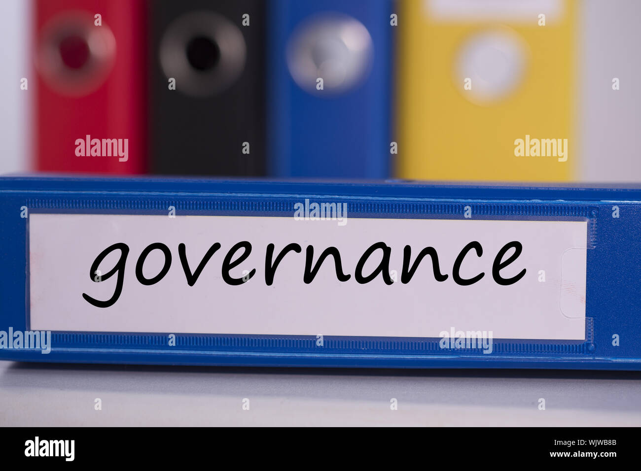 The word governance on blue business binder Stock Photo - Alamy