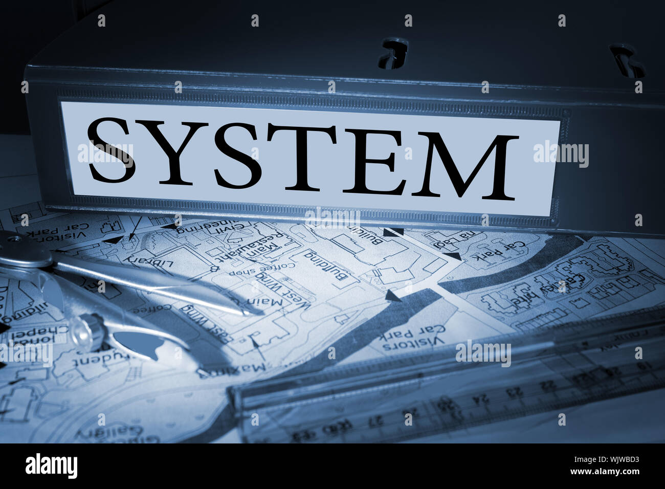 The word system on blue business binder on a desk Stock Photo - Alamy