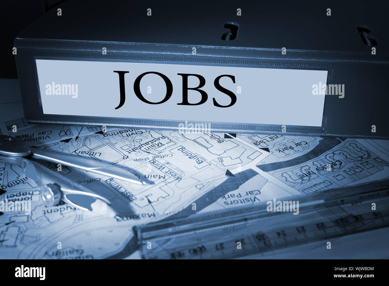The word jobs on blue business binder on a desk Stock Photo - Alamy
