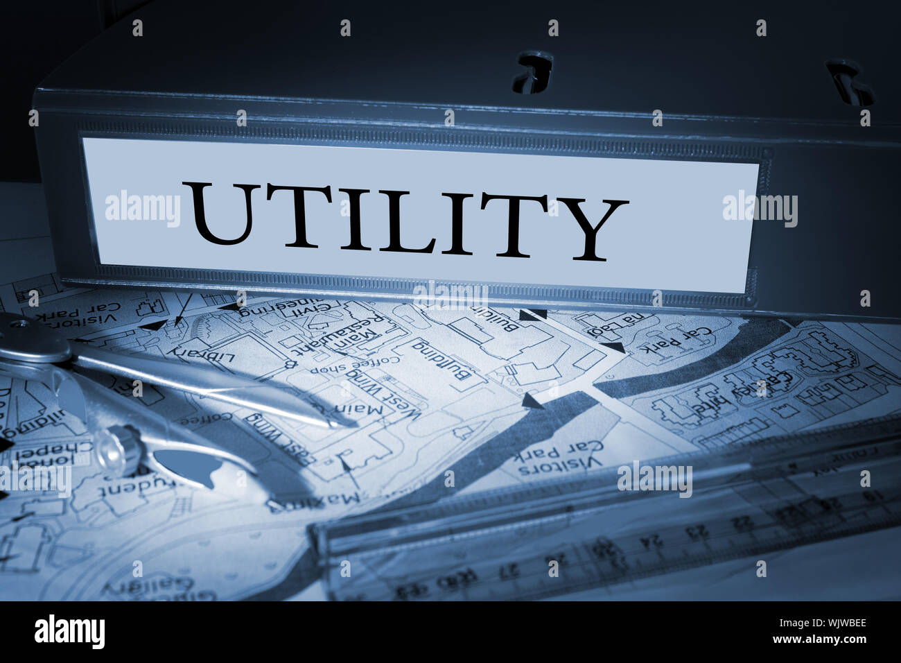 The word utility on blue business binder on a desk Stock Photo - Alamy