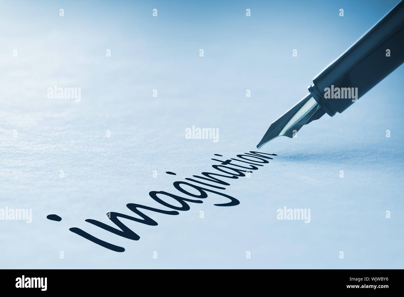 Fountain pen writing the word imagination Stock Photo - Alamy