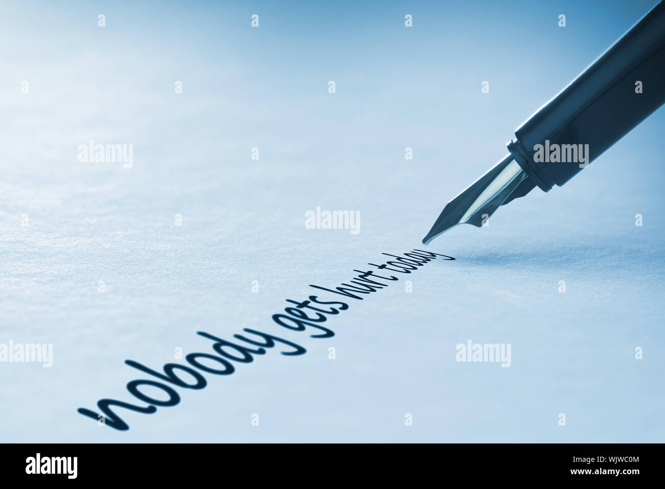 Fountain pen writing the word nobody gets hurt today Stock Photo - Alamy