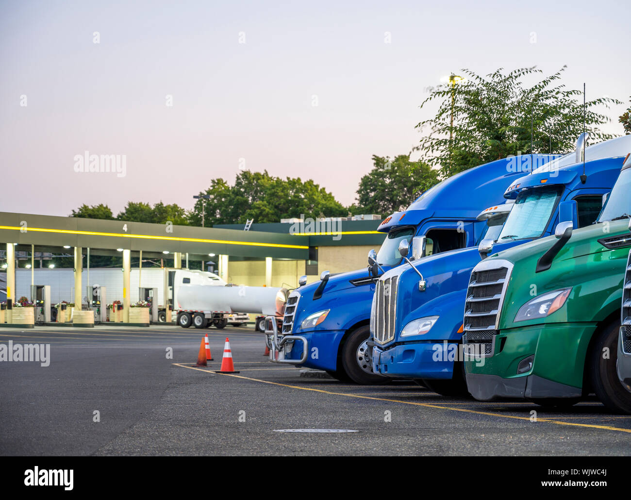 Different make and models big rigs semi trucks with semi trailers ...