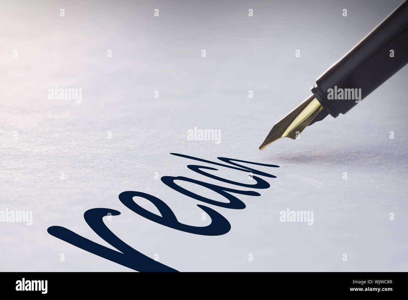 Fountain pen writing the word reach Stock Photo - Alamy