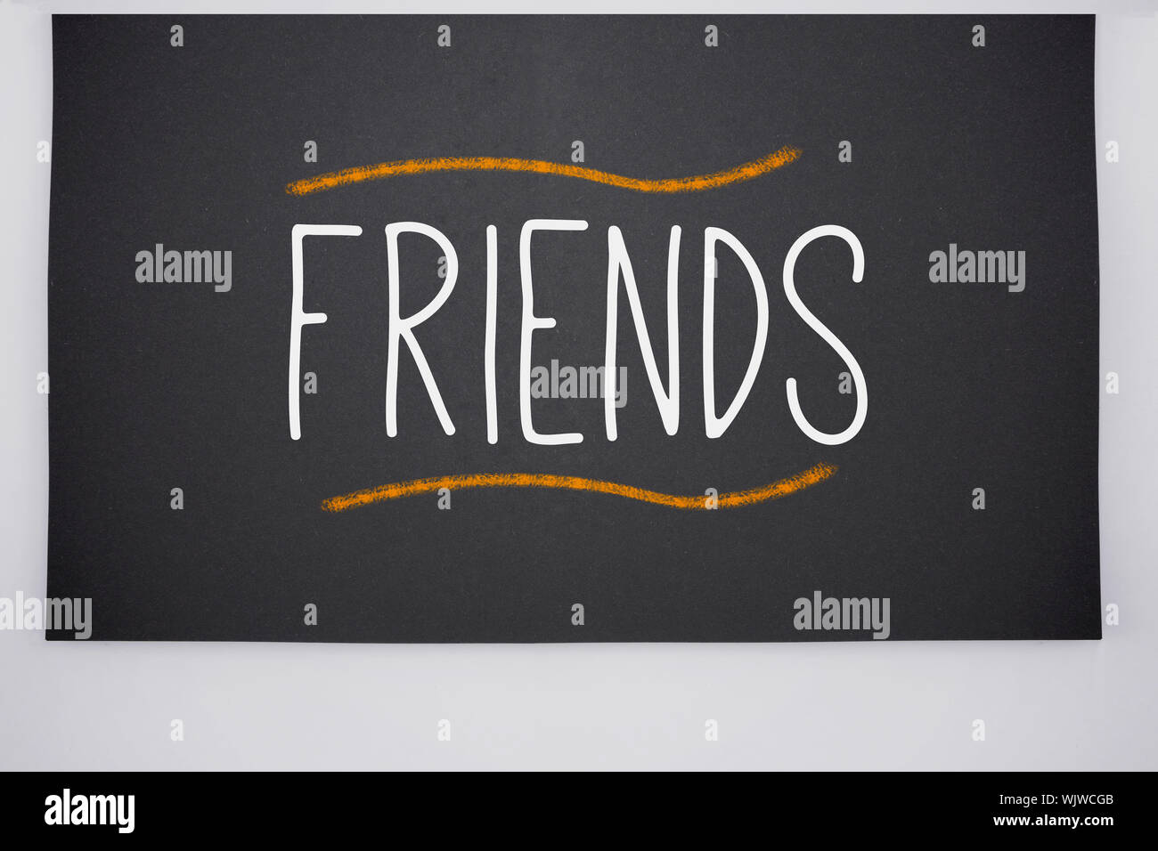 The word friends written on big blackboard Stock Photo - Alamy