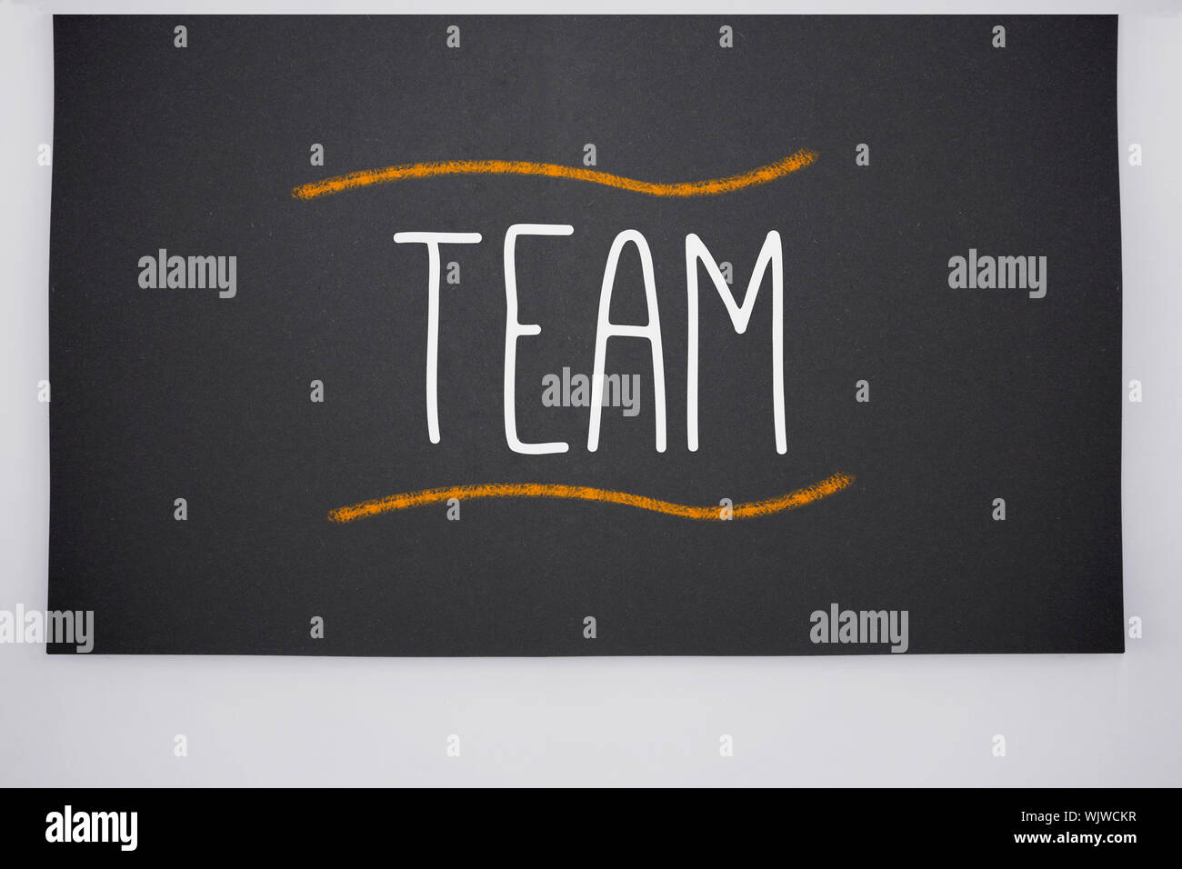 The word team written on big blackboard Stock Photo - Alamy