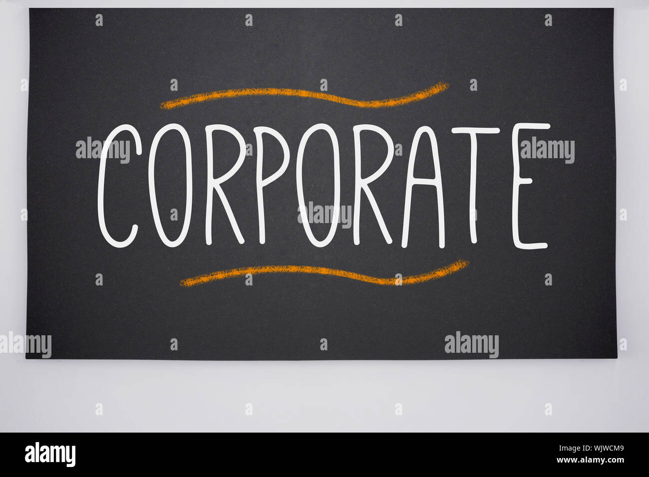 The word corporate written on big blackboard Stock Photo - Alamy