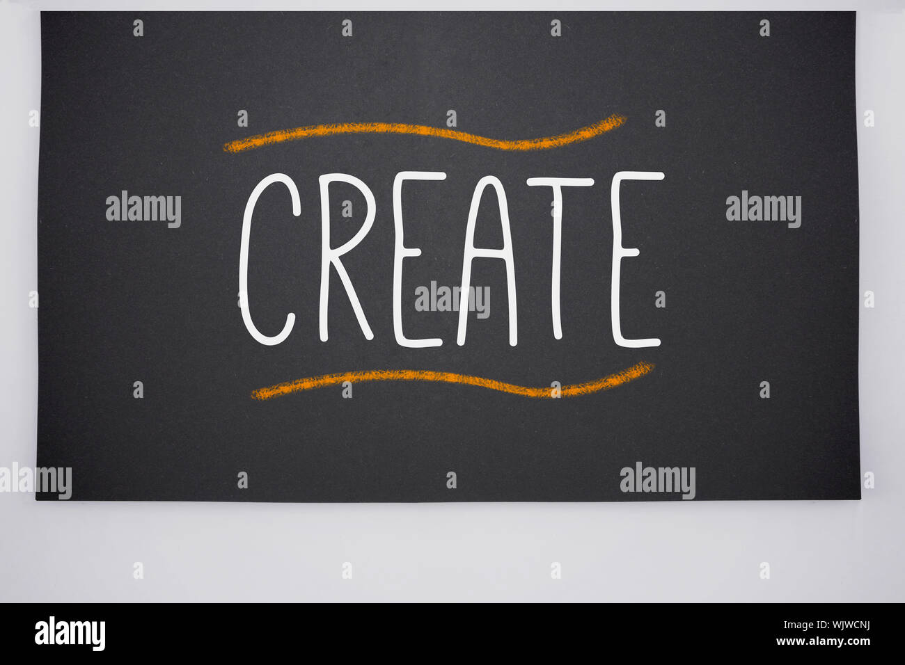 The word create written on big blackboard Stock Photo - Alamy