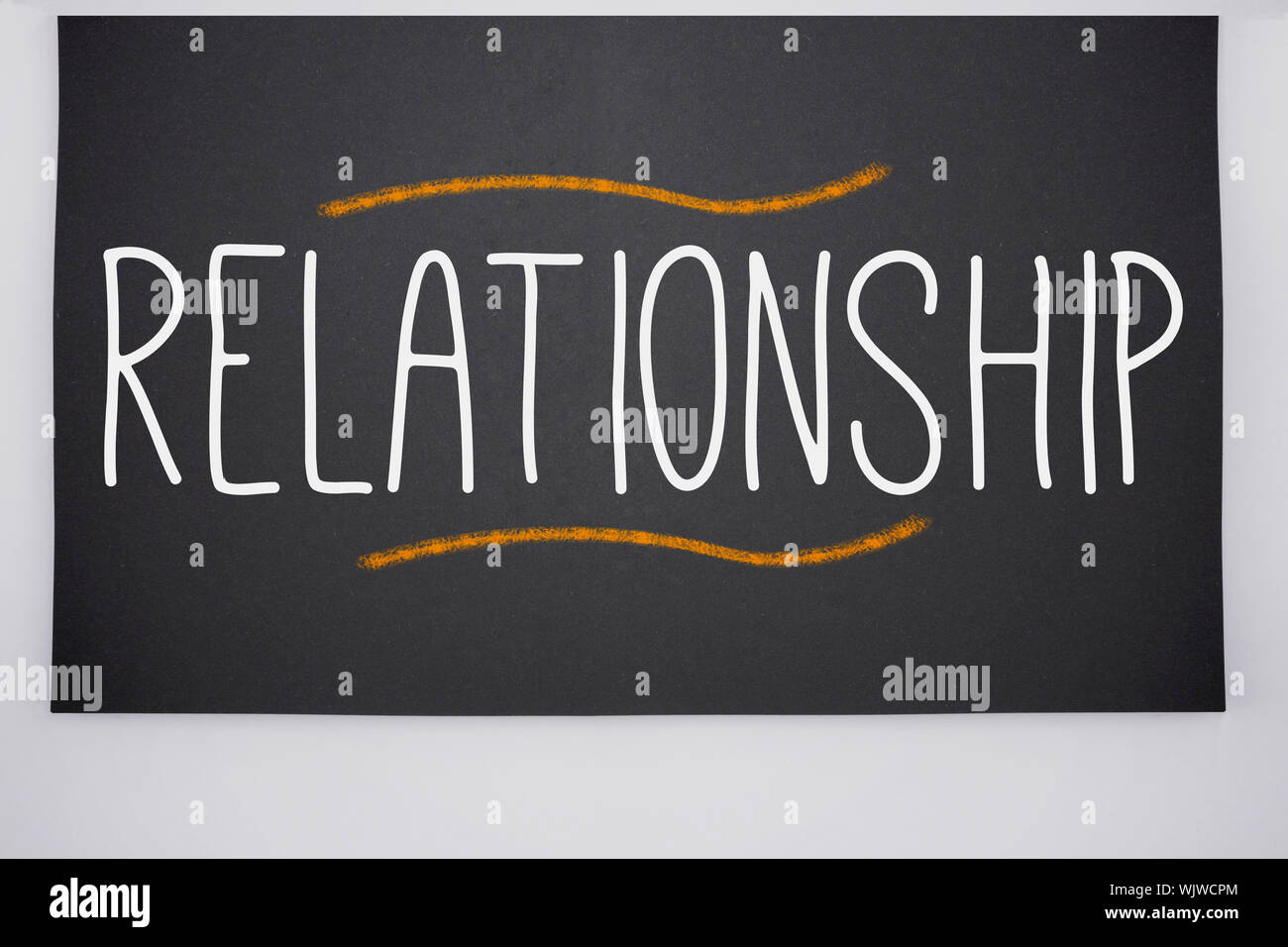 The word relationship written on big blackboard Stock Photo - Alamy
