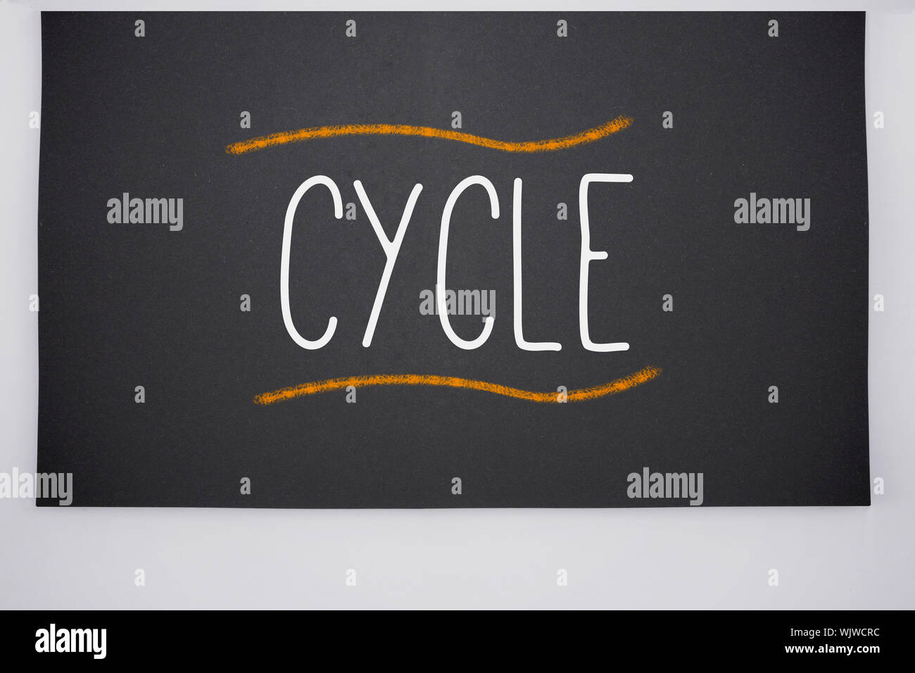 The word cycle written on big blackboard Stock Photo - Alamy
